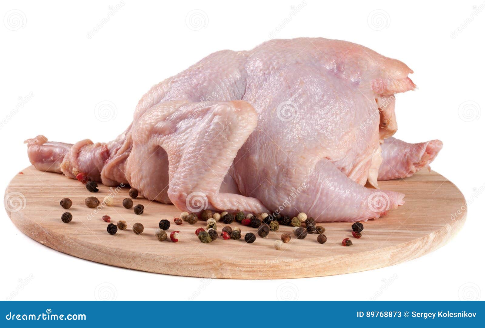 Raw Chicken Carcass with Peppercorns on the Cutting Board Isolated on ...