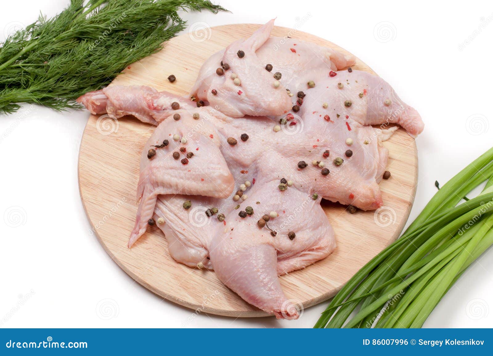 Raw Chicken Carcass with Peppercorns and Greenery on the Cutting Board ...