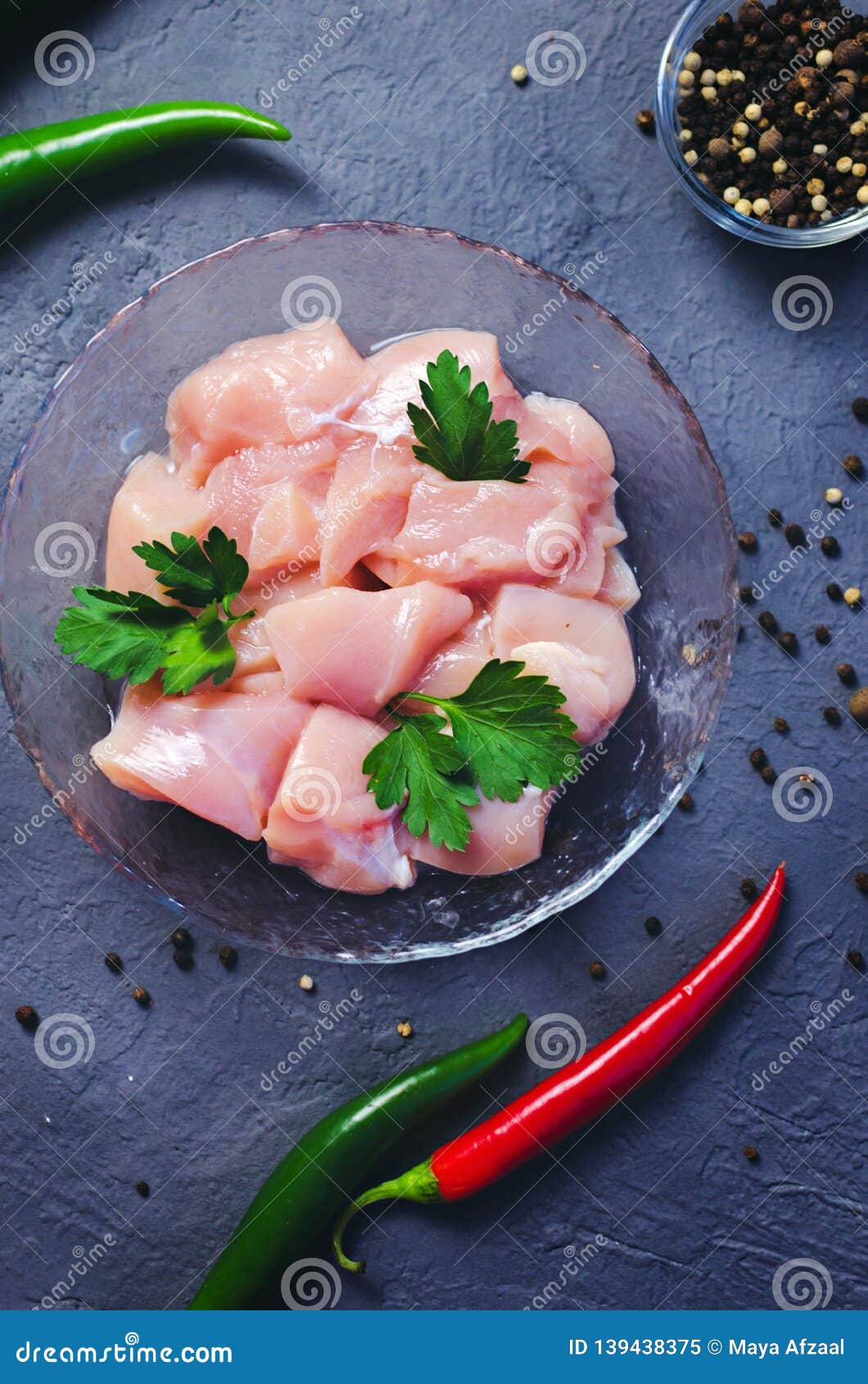 Raw Chicken Cubes in Bowl on Dark Stone Table. Breast Cubes Stock Image ...