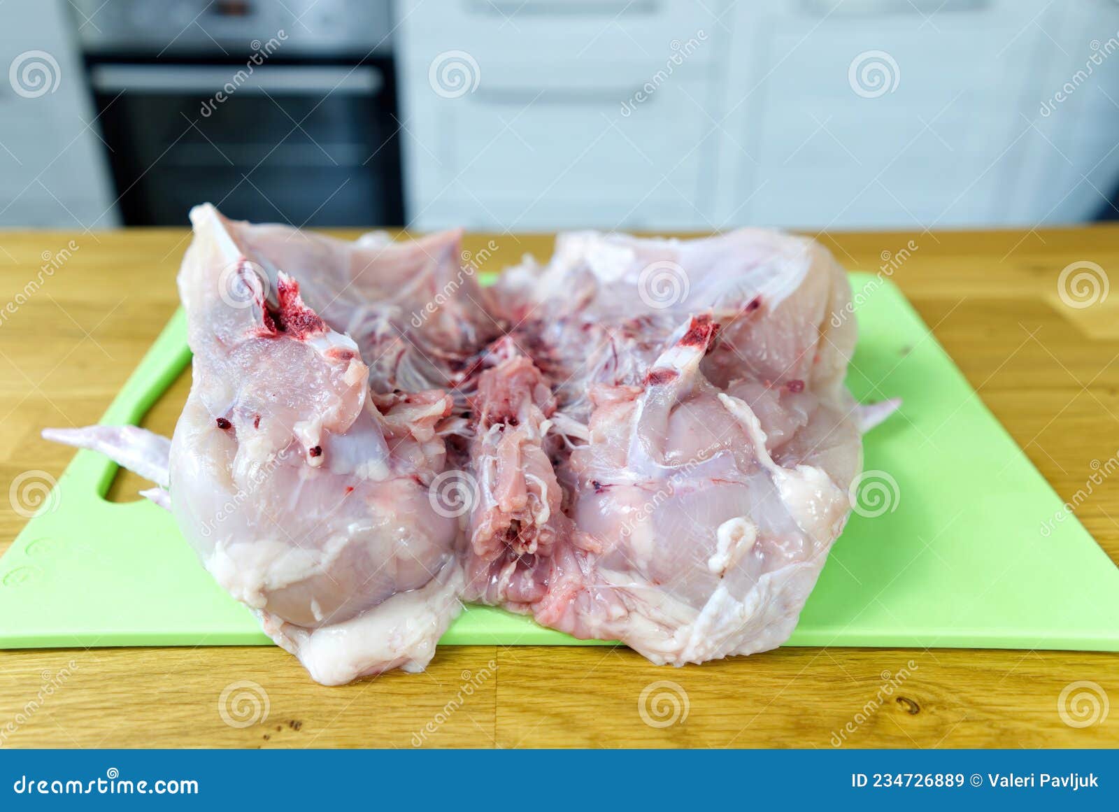 Raw Chicken Cutted in Half on a Cutting Board. Home Food Making Process ...