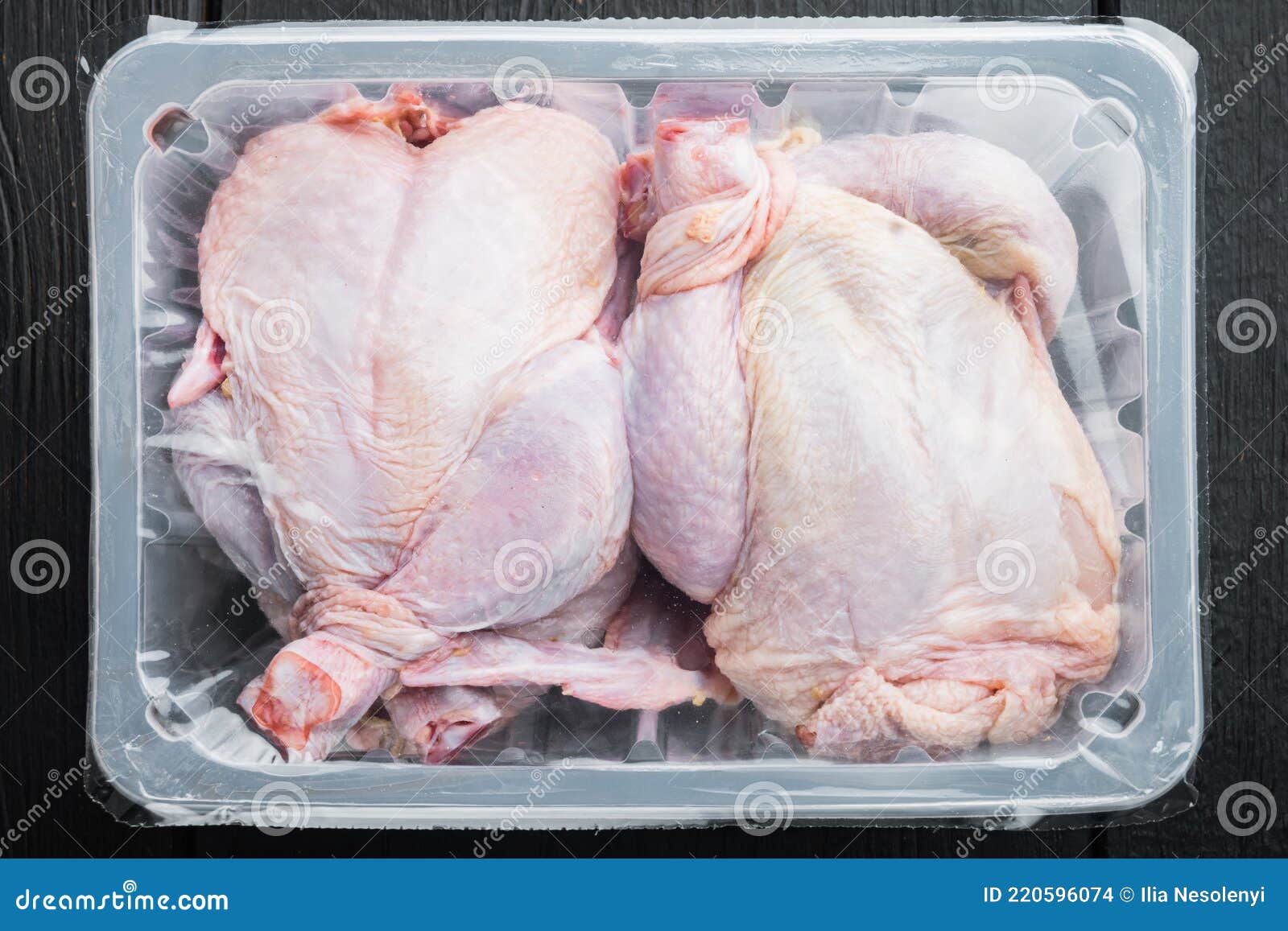 Raw Chicken in Plastic Sealed Box, on Black Wooden Table, Top View ...