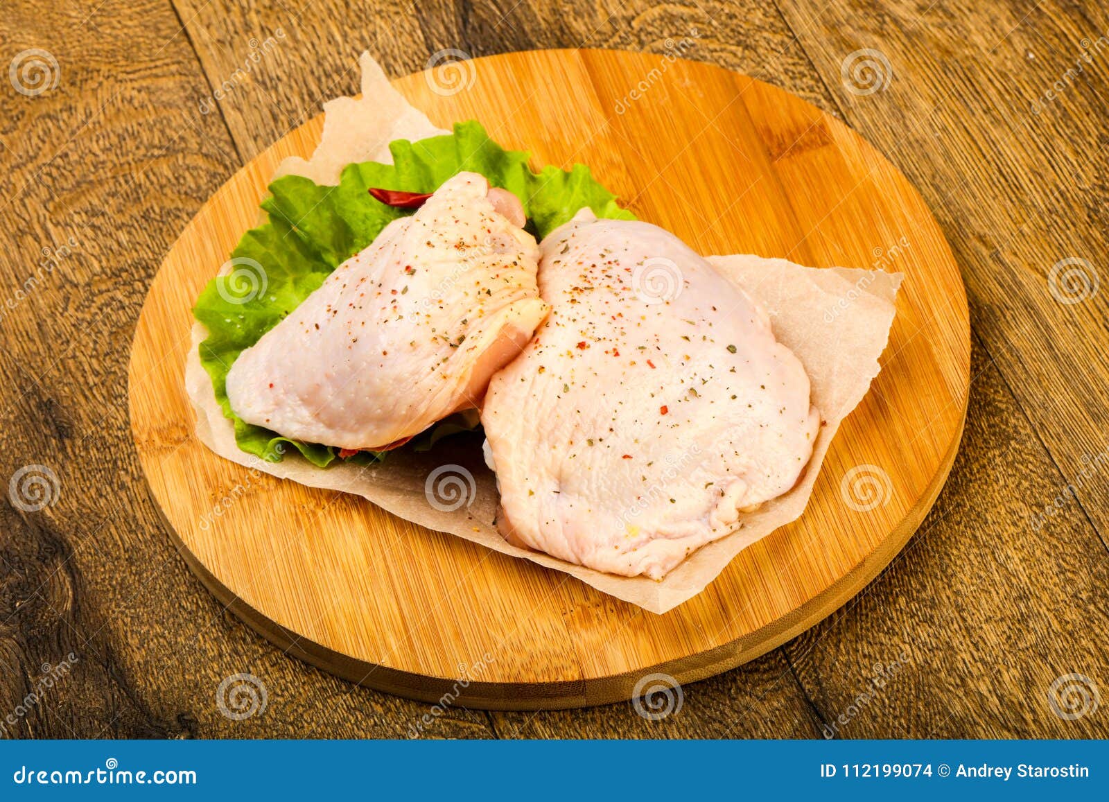 Raw chicken thigh stock photo. Image of board, food - 112199074
