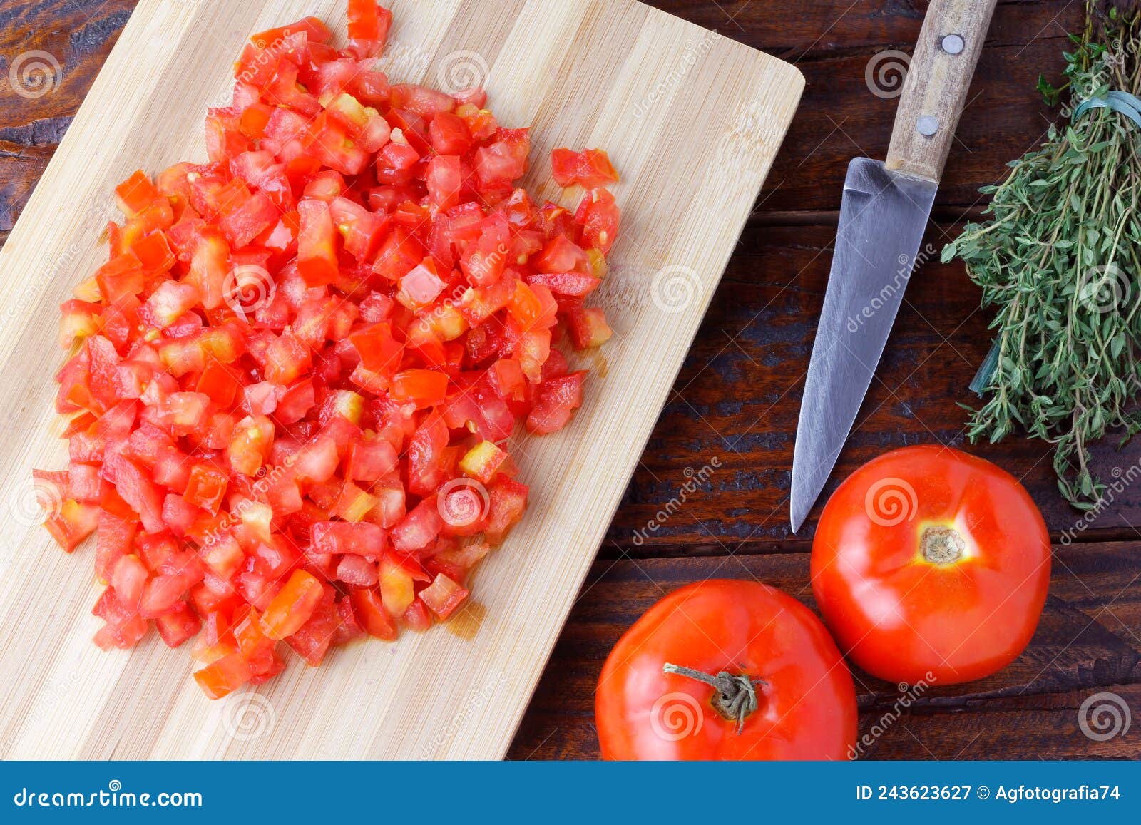 Raw Chopped and Diced Tomatoes Cubes Over Rustic Wooden Table Stock ...