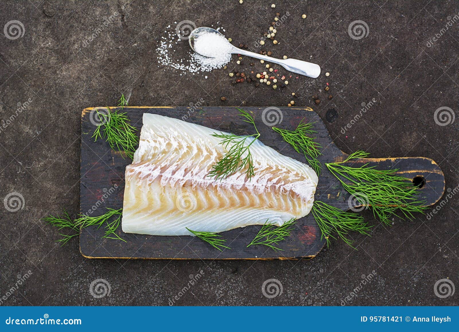 Raw Cod before Cooking on a Black Chopping Board with Herbs and Sea ...