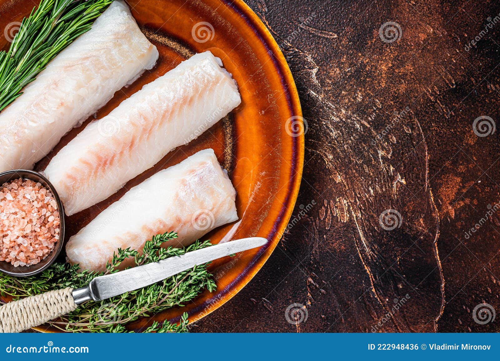 Raw Cod Loin Fillet Steaks on Rustic Plate with Thyme and Salt. Dark ...