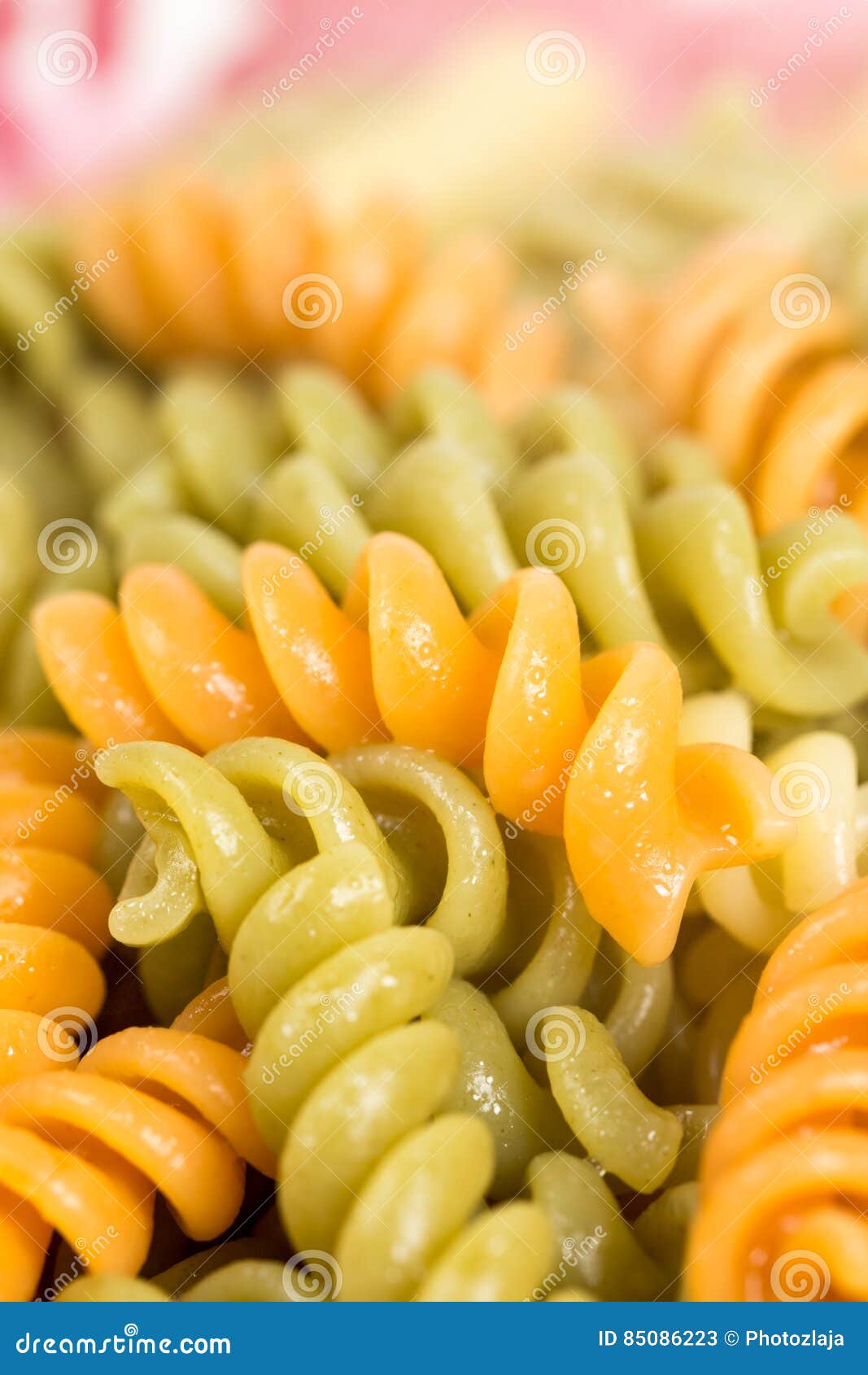 Raw Colored Macaroni on the Wooden Board with Copy Space Stock Image ...