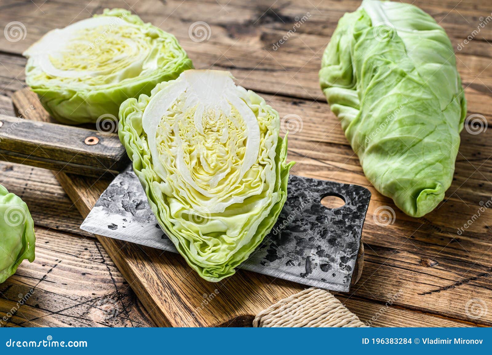 Raw Cutting Pointed White Cabbage Head on a Cutting Board. Wooden ...