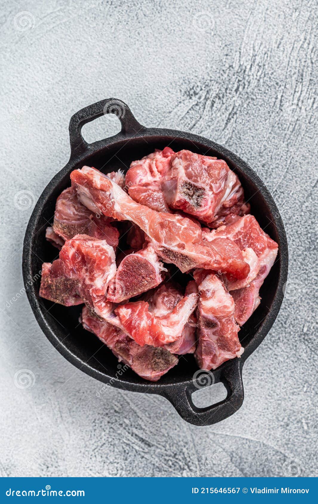 Raw Diced Meat Cubes with Bone in a Pan. White Background Stock Image ...