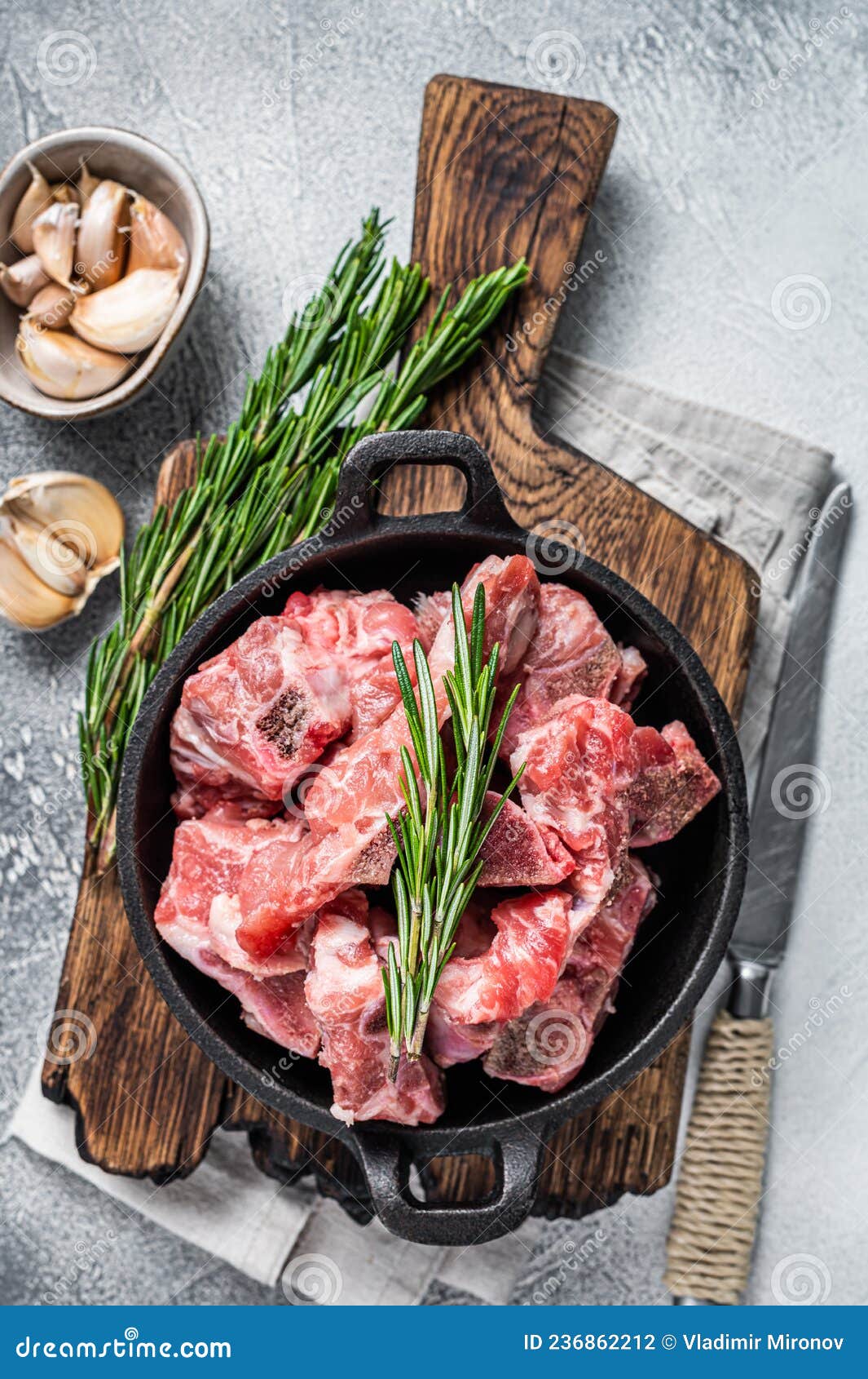 Raw Diced Meat Cubes with Bone in a Pan. White Background Stock Photo ...