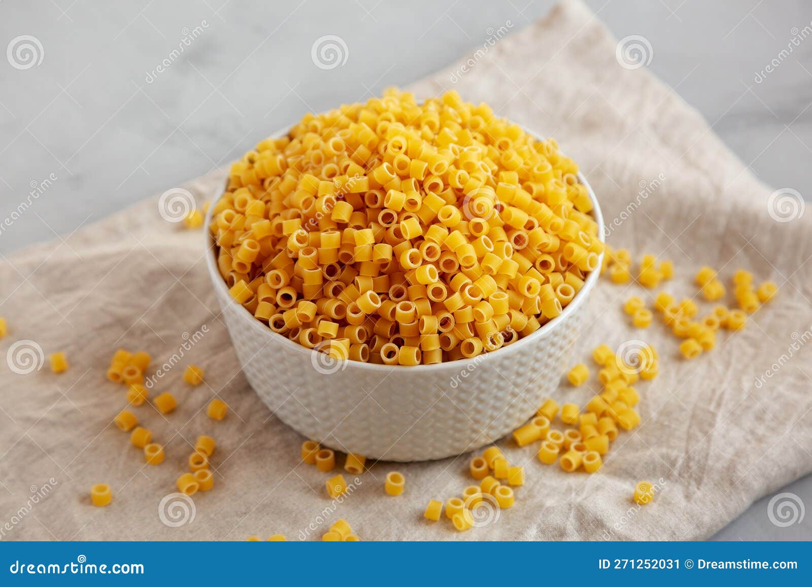 Raw Ditalini Pasta in a Bowl on a Gray Background, Side View Stock ...