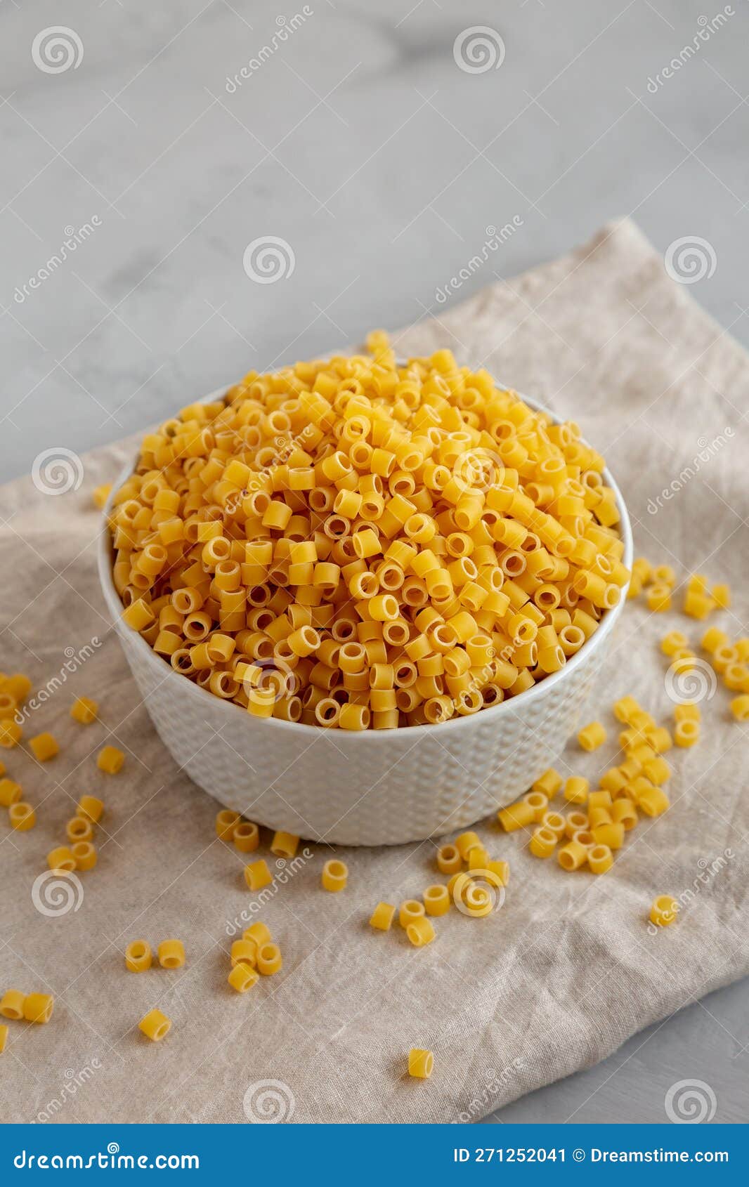 Raw Ditalini Pasta in a Bowl on a Gray Background, Side View Stock ...
