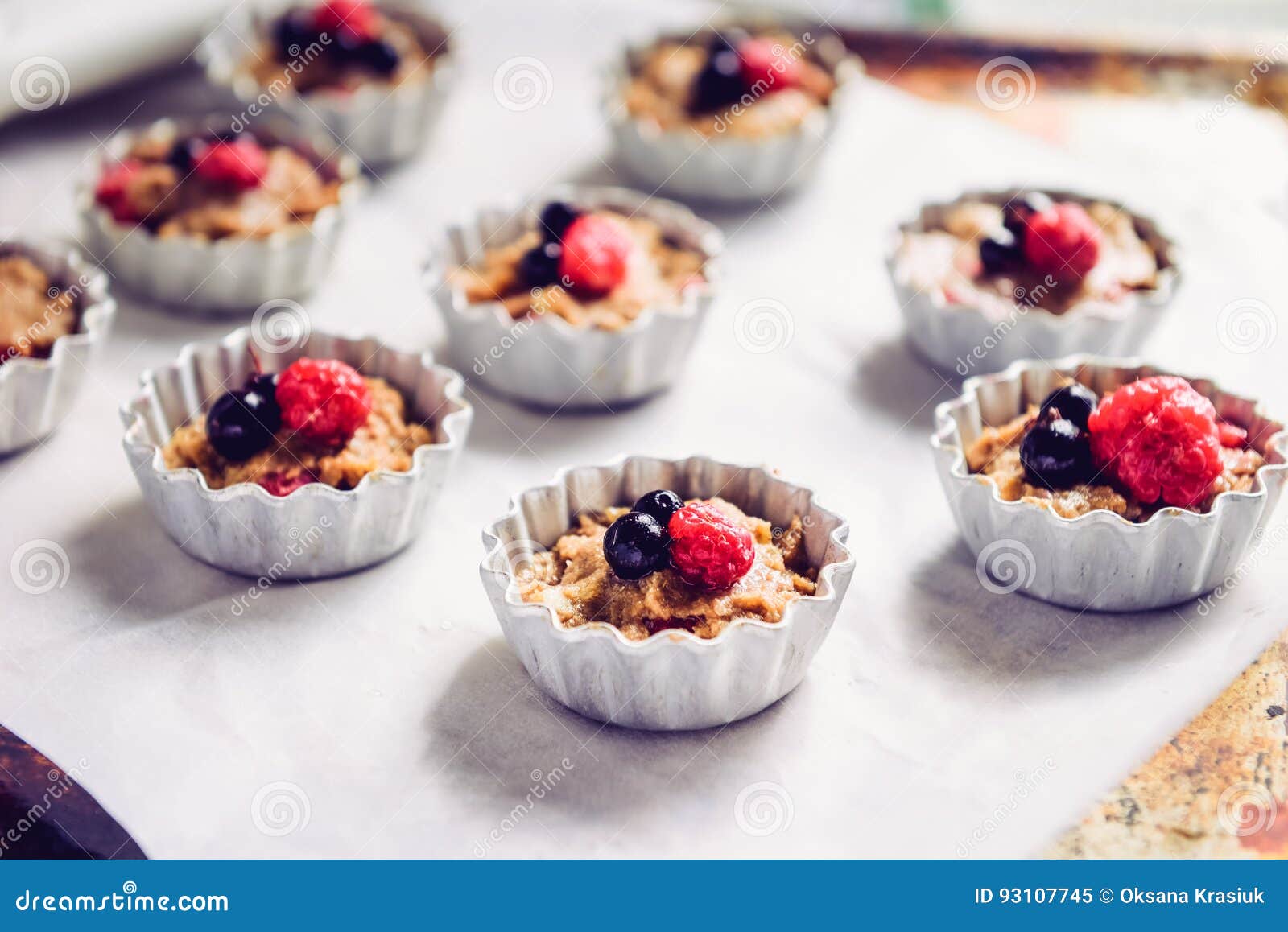 Raw Dough with Berries for Cupcakes Decomposed into Forms on a Baking ...