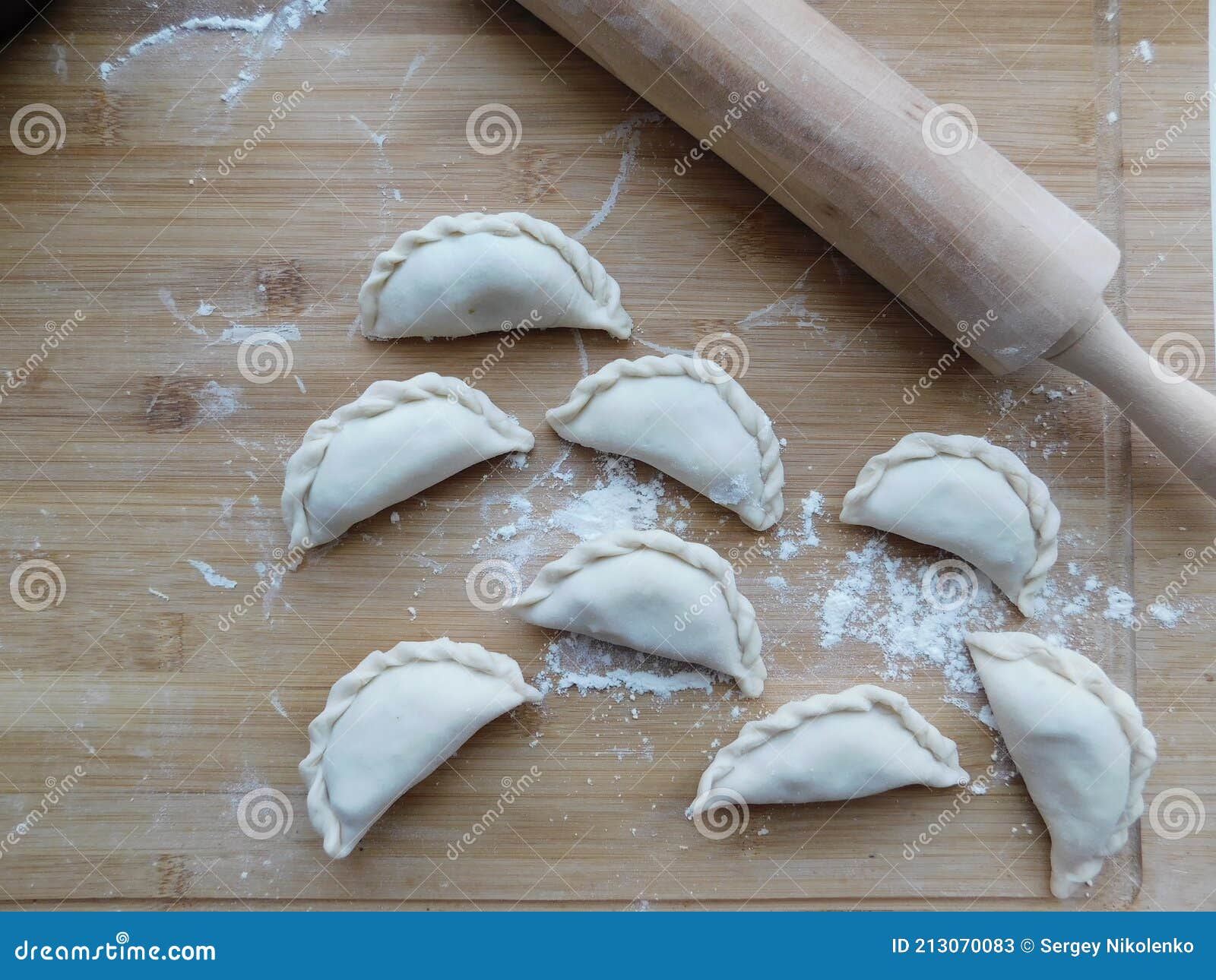 Raw Dumplings on a Wooden Board . the Process of Making Dumplings Stock ...