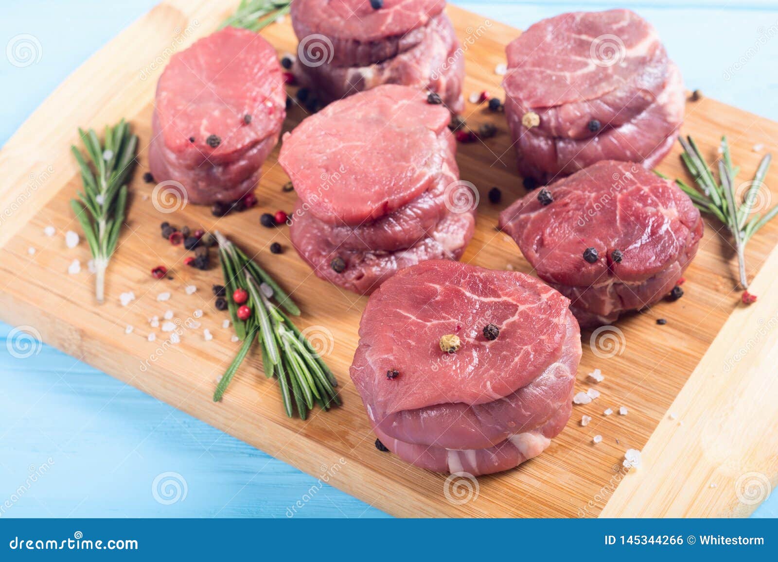 Raw filet mignon stock photo. Image of rosemary, protein - 145344266