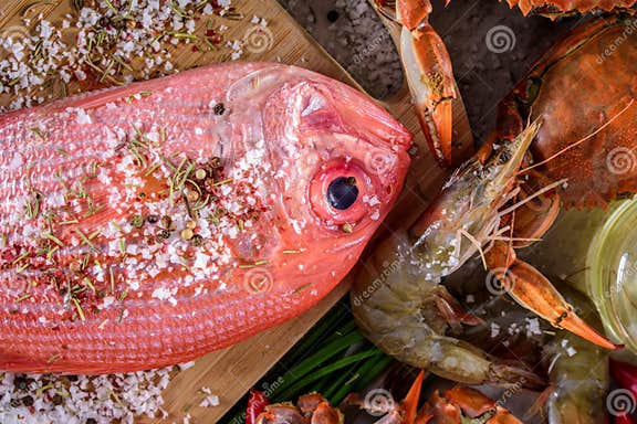 Vibrant Close-Up: Fresh Raw Red Snapper Fish with Zesty Lemon Accent in ...