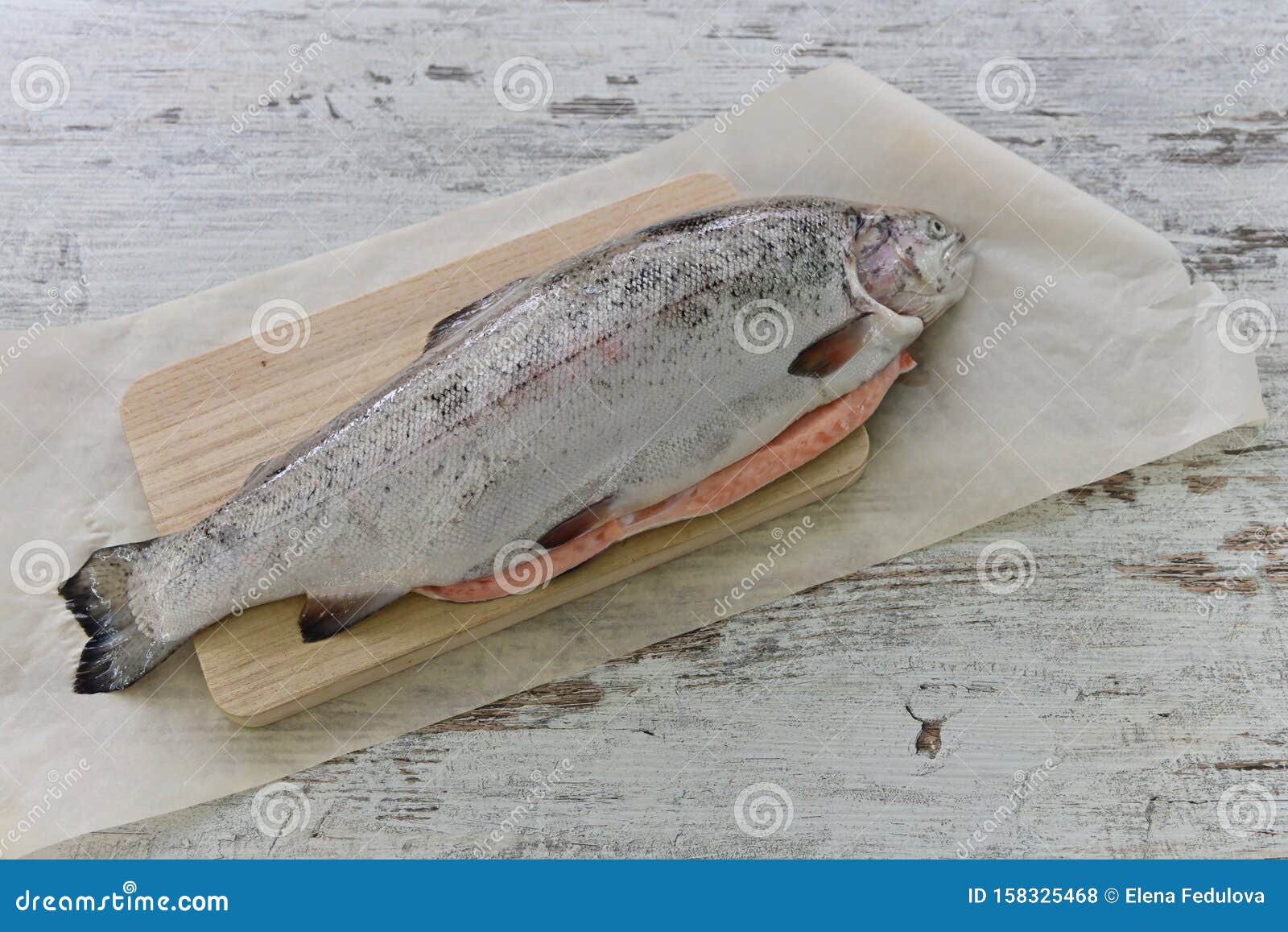 Raw Fish for Cooking with Vegetables on the Kitchen Table. Stock Photo ...
