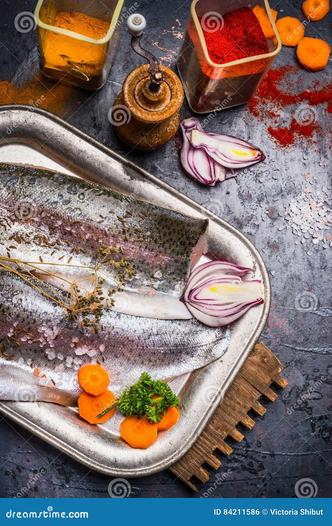 Raw Fish Fillets with Spices, Cooking Preparation on Dark Kitchen Table ...