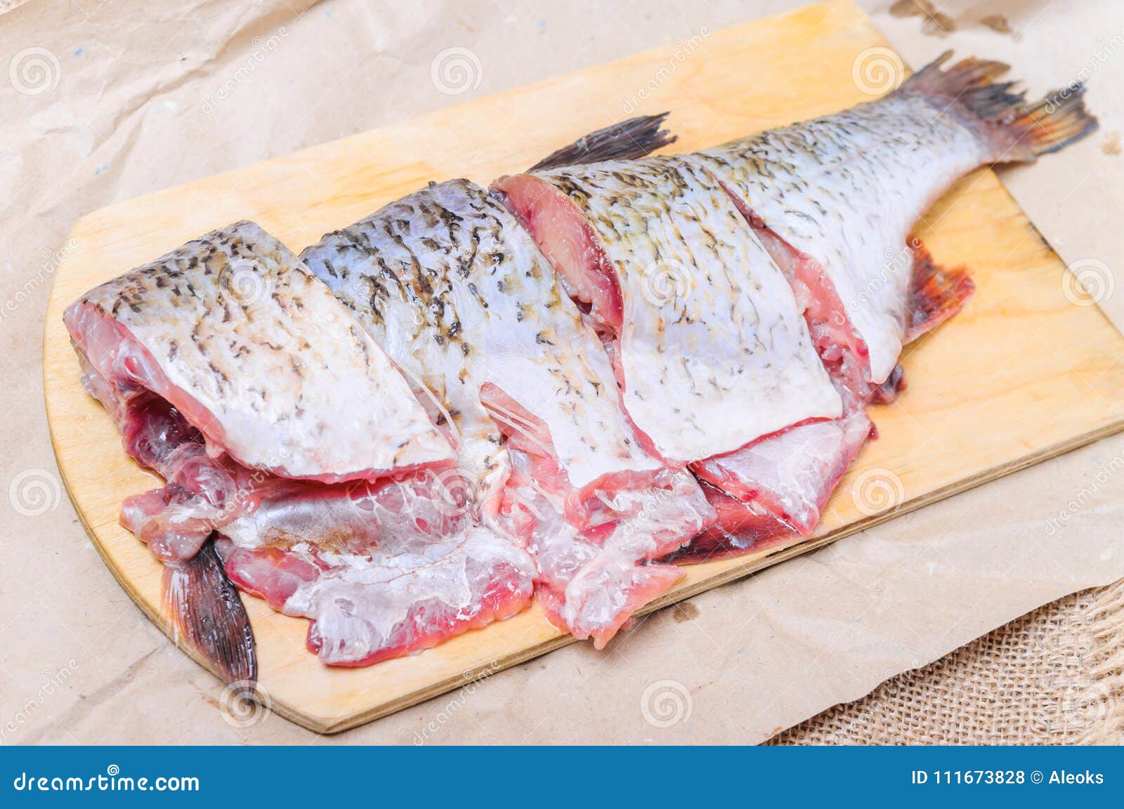 Raw Fish Ide Cut into Pieces for Cooking on a Chopping Board Stock ...