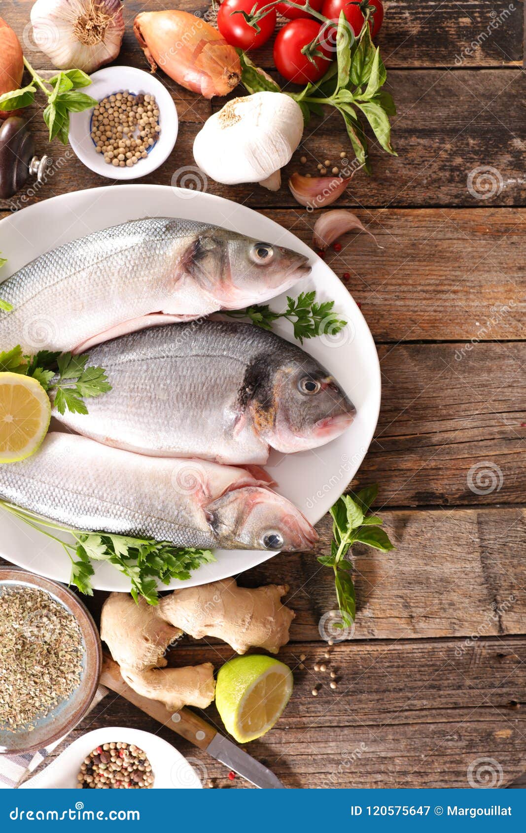 Raw fish and ingredients stock image. Image of background - 120575647