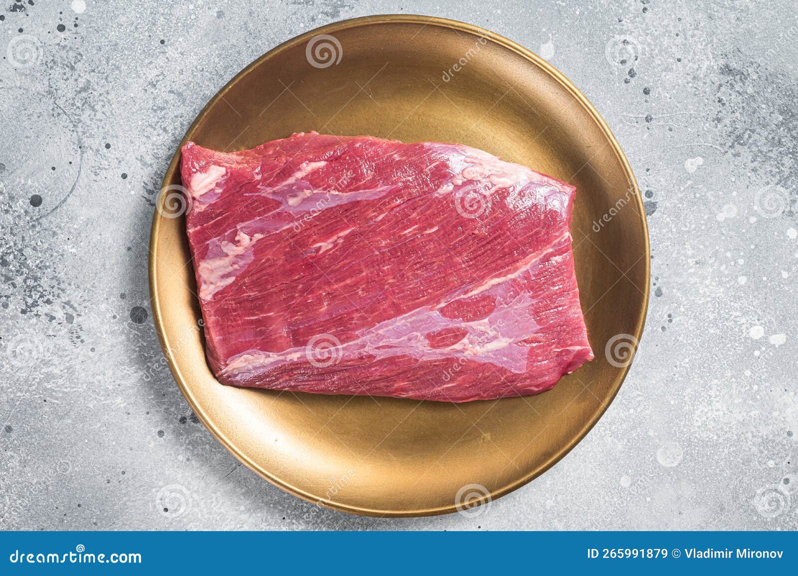 Raw Flank Beef Marbled Meat Steak on Butcher Table. Gray Background ...