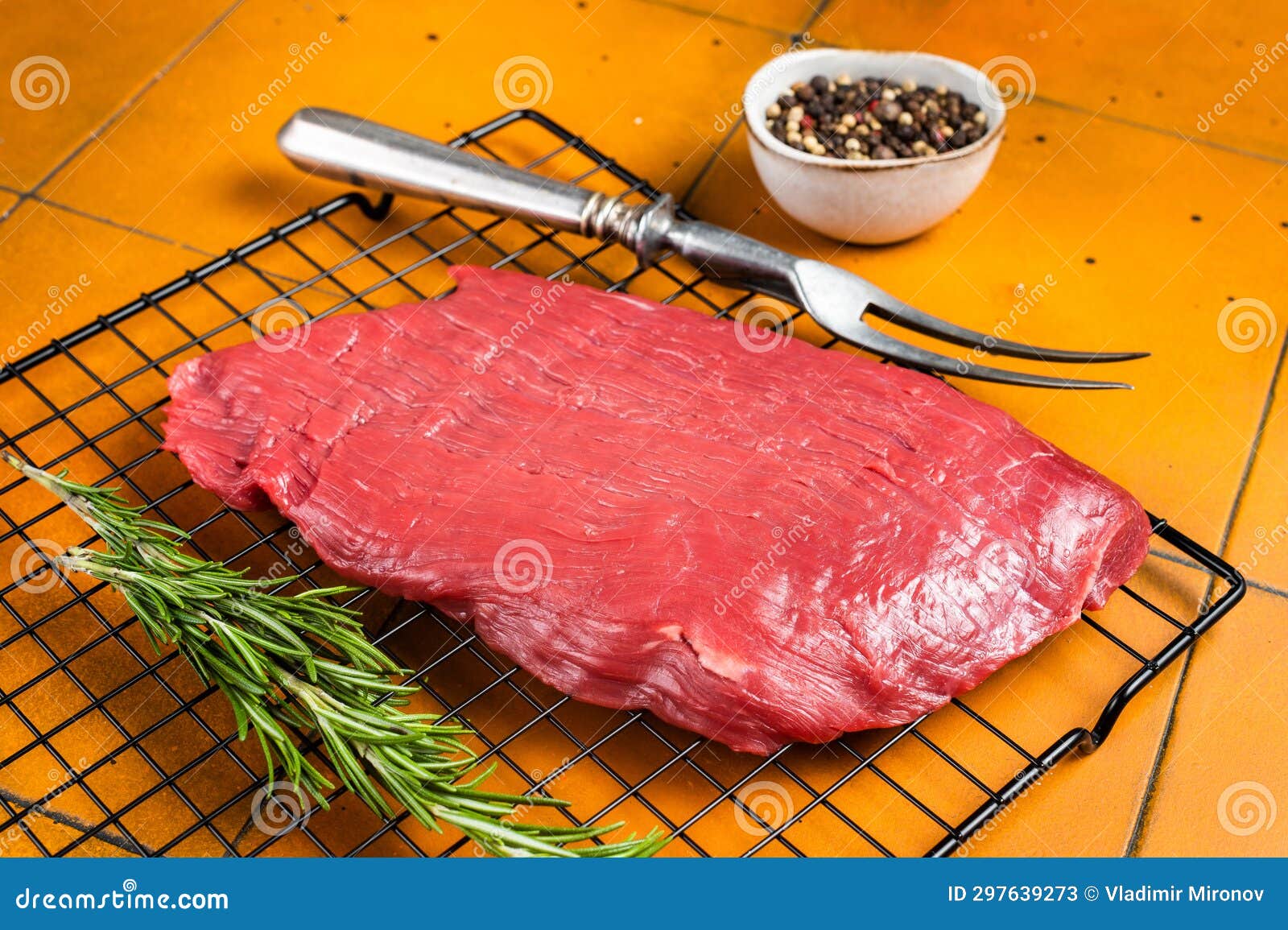 Raw Flank Beef Meat Steak Ready for Grilling. Orange Background Stock ...