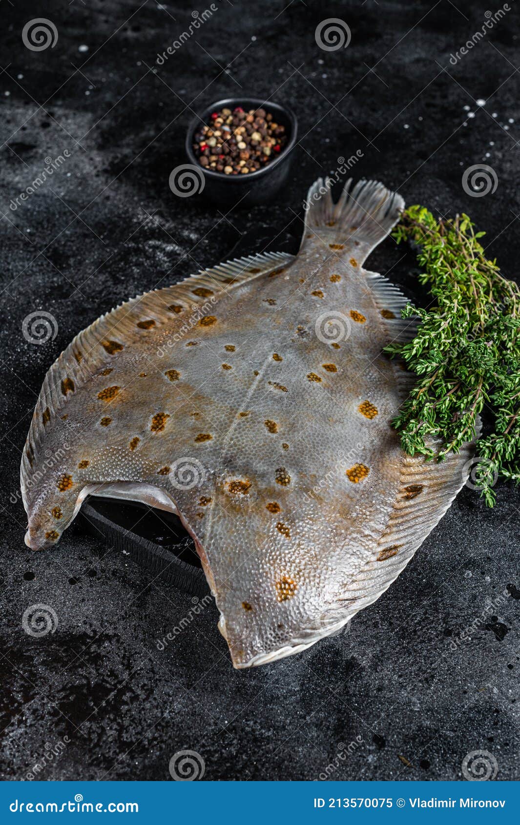Raw Flounder Flatfish Fish on Marble Board with Thyme. Black Background ...