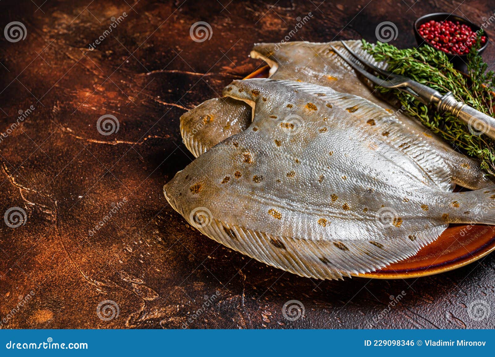 Raw Flounder or Plaice on Rustic Plate with Herbs. Dark Background. Top ...