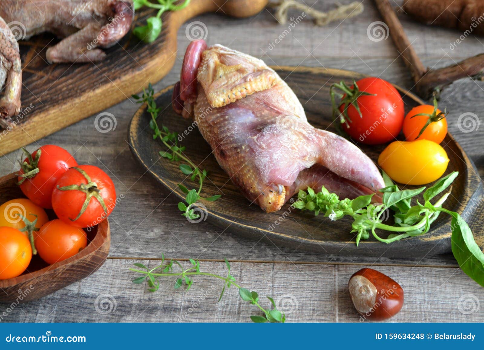 Raw Fowl Partridge and Fresh Vegetables on a Table, Rustic Style Stock ...