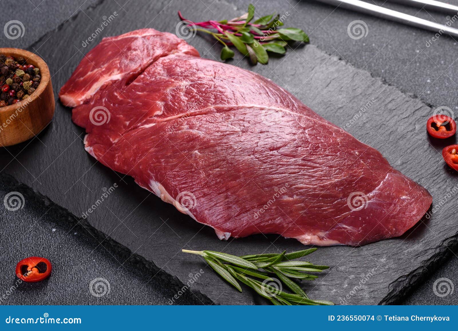 Raw Fresh Chuck Roll Steak with Herbs and Salt on a Cutting Board Stock ...
