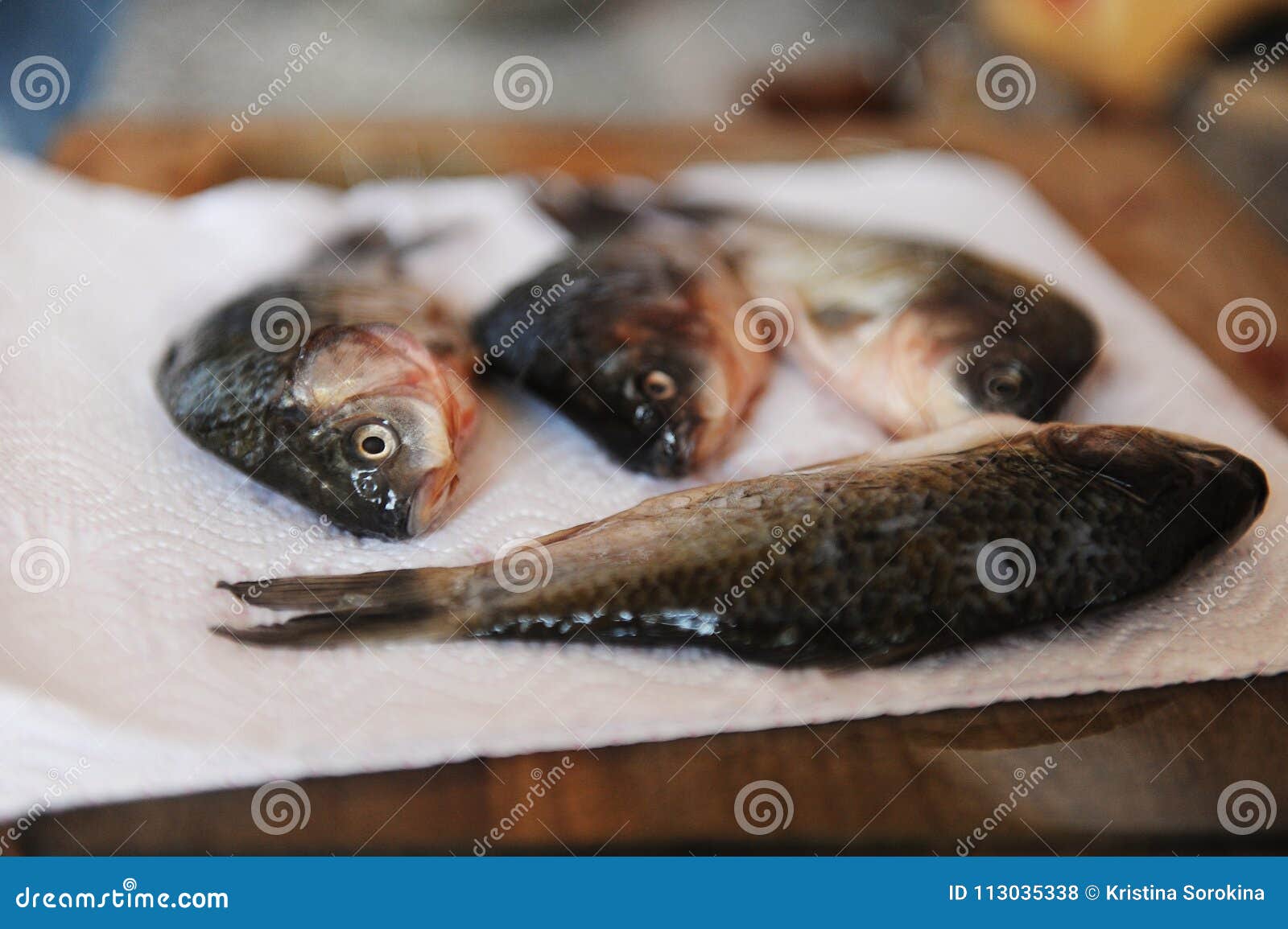 Raw Fresh Fish Whole on Cut Board. the Cooking Process. Stock Photo ...