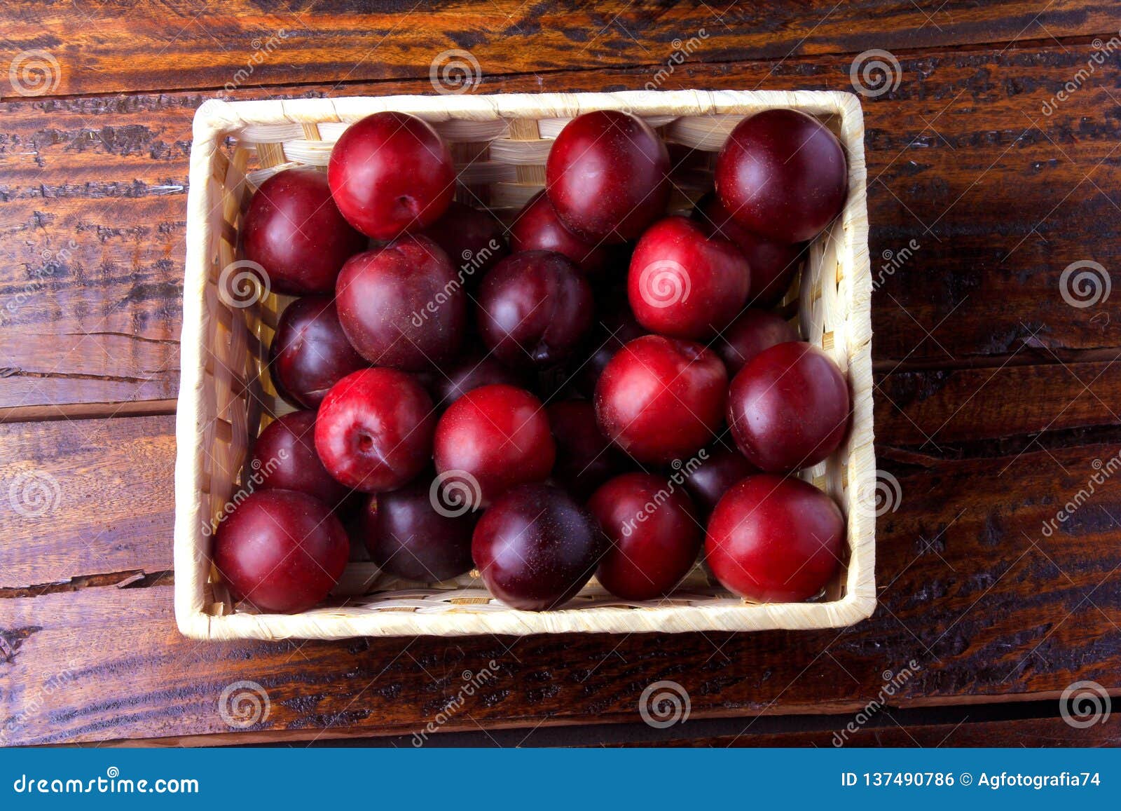 Raw and Fresh Organic Plums Inside Rustic Fabric Wooden Box on Rustic ...