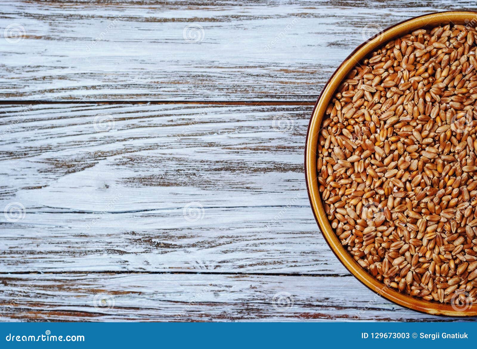 Raw grain in a plate stock image. Image of nutrition - 129673003