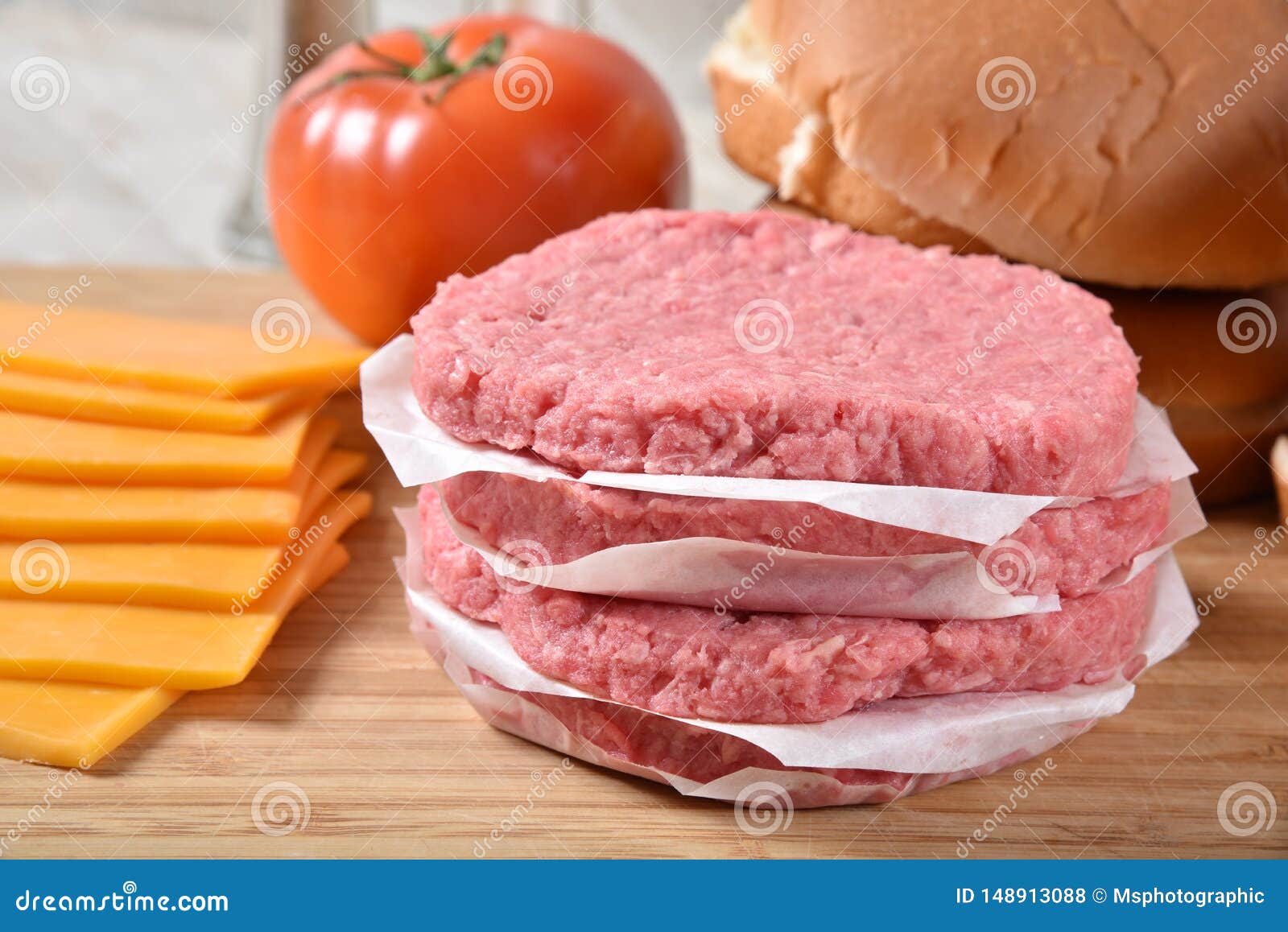 Raw ground beef patties stock photo. Image of board - 148913088