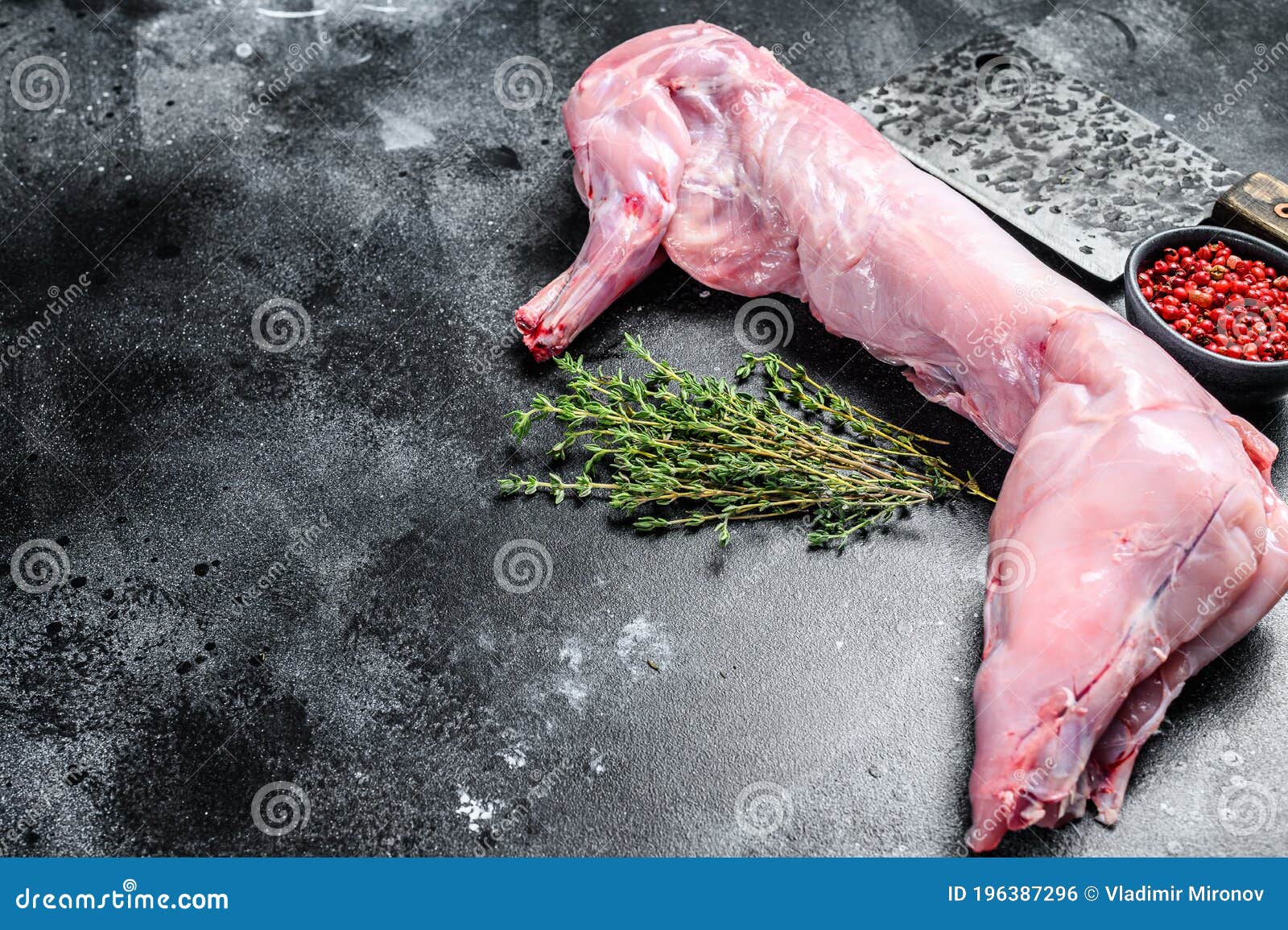 Raw Hare Meat with Spices for Cooking. Black Background. Top View Stock ...