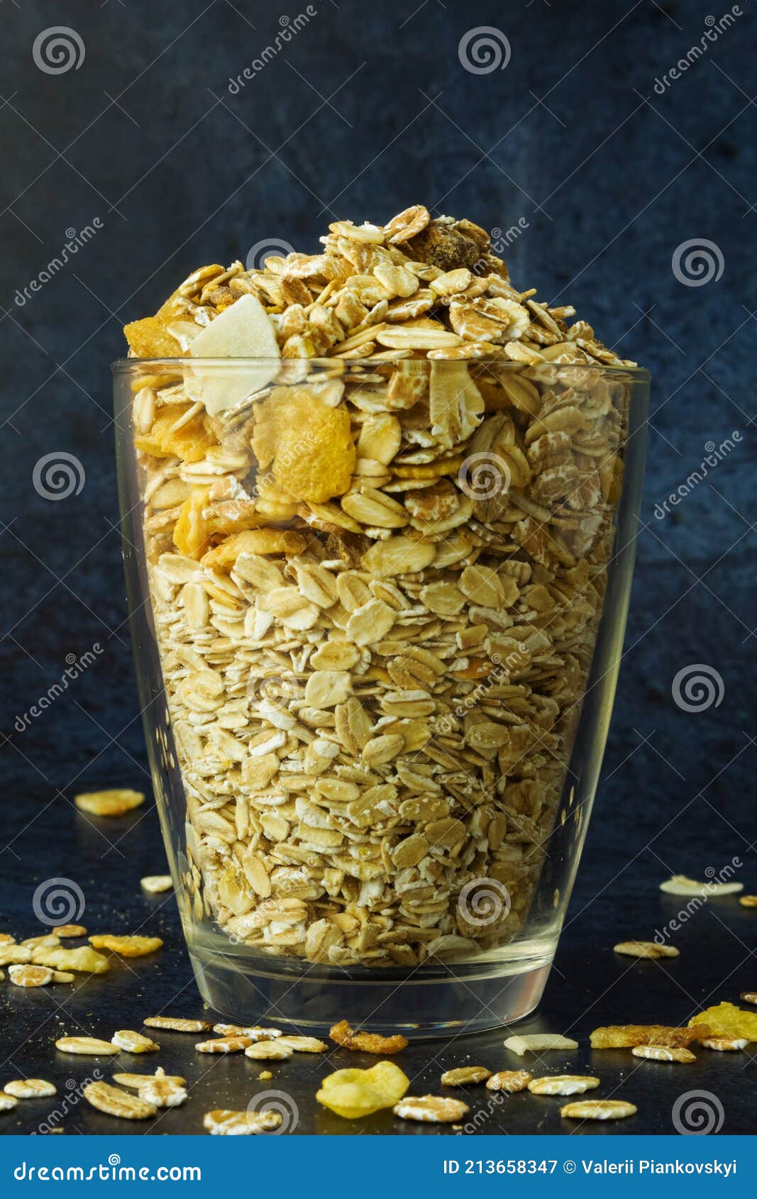Raw Healthy Breakfast Mix in Glass on Dark Blue Background Front View ...