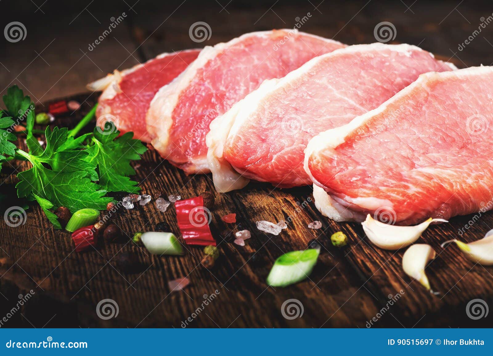 Raw Juicy Meat Steaks Ready for Roasting on a Black Chalk Board Stock ...