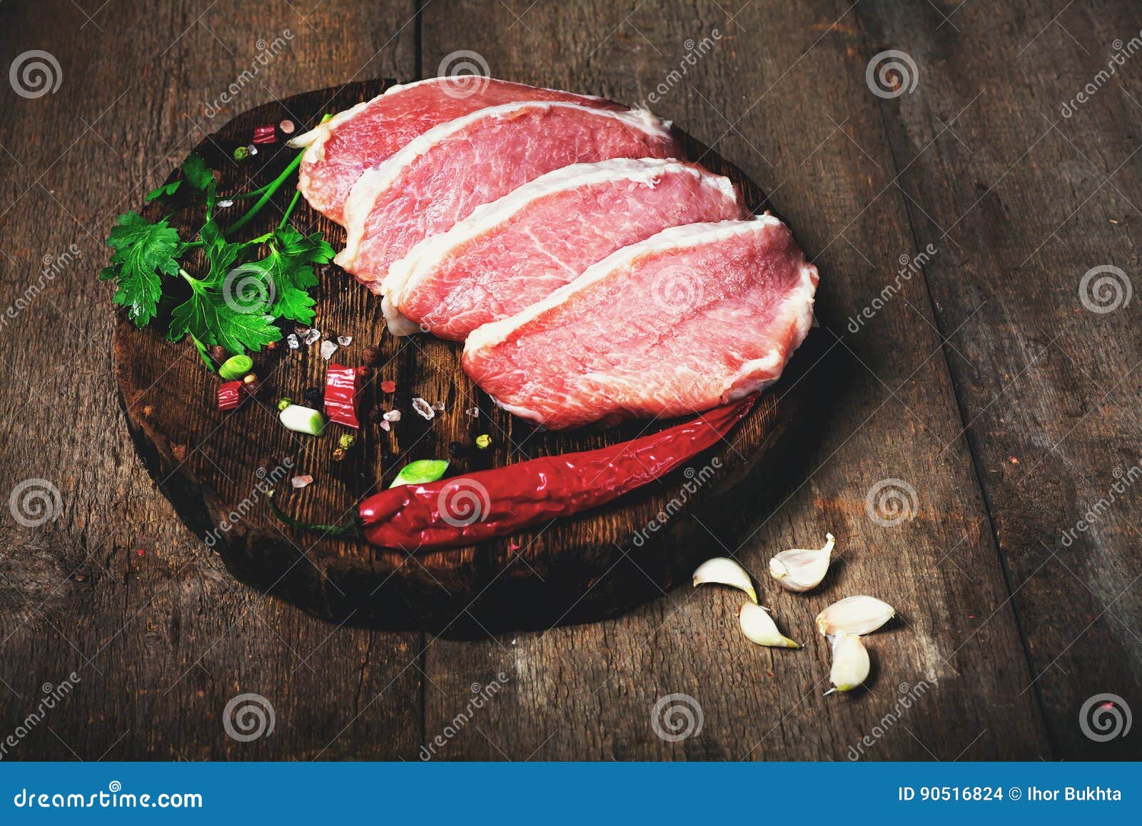 Raw Juicy Meat Steaks Ready for Roasting on a Black Chalk Board Stock ...