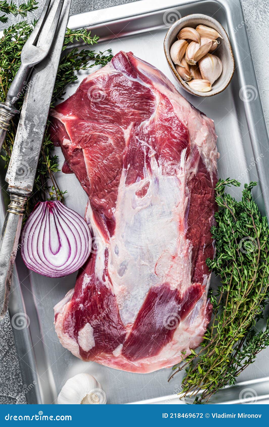 Raw Lamb Mutton Shoulder Meat in a Baking Dish with Thyme and Garlic ...