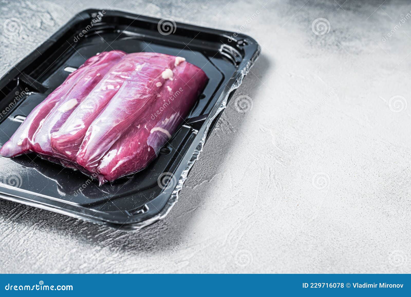 Raw Lamb Tenderloin in Vacuum Packaging. White Background. Top View ...