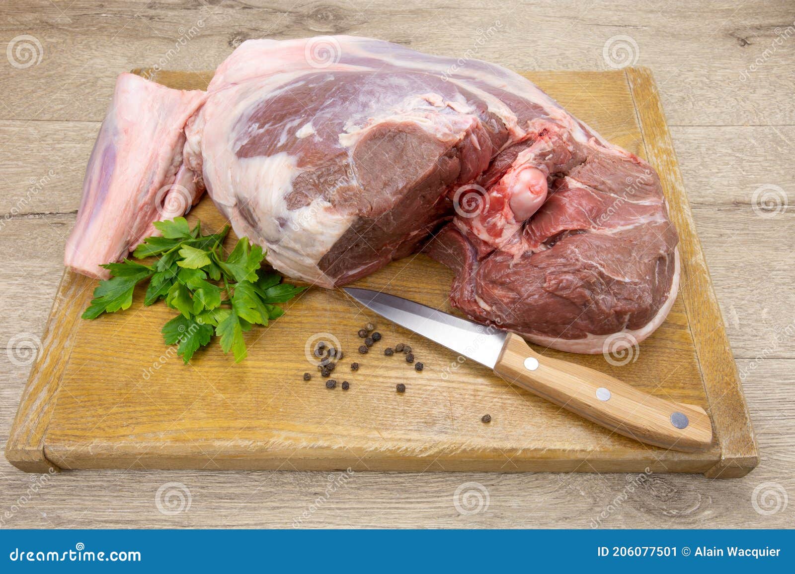 Raw leg of lamb on a table stock image. Image of kitchen - 206077501