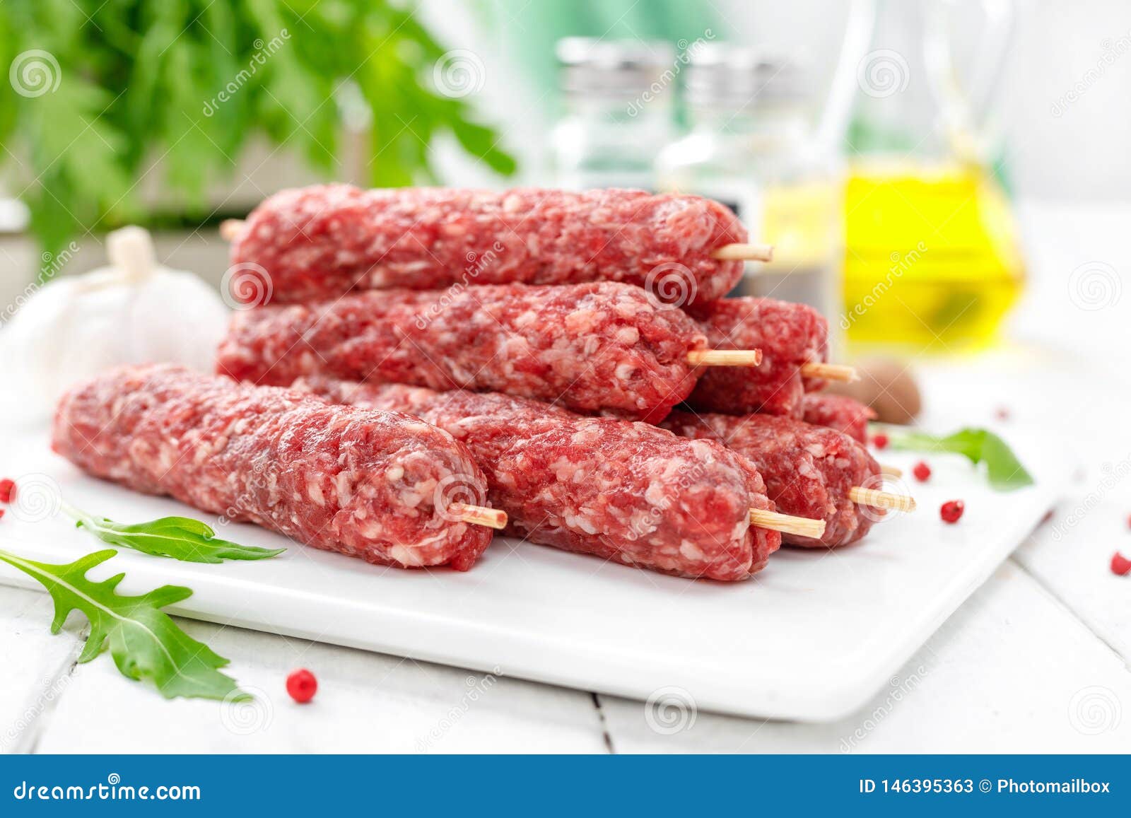 Raw lula kebab on skewers stock image. Image of food - 146395363