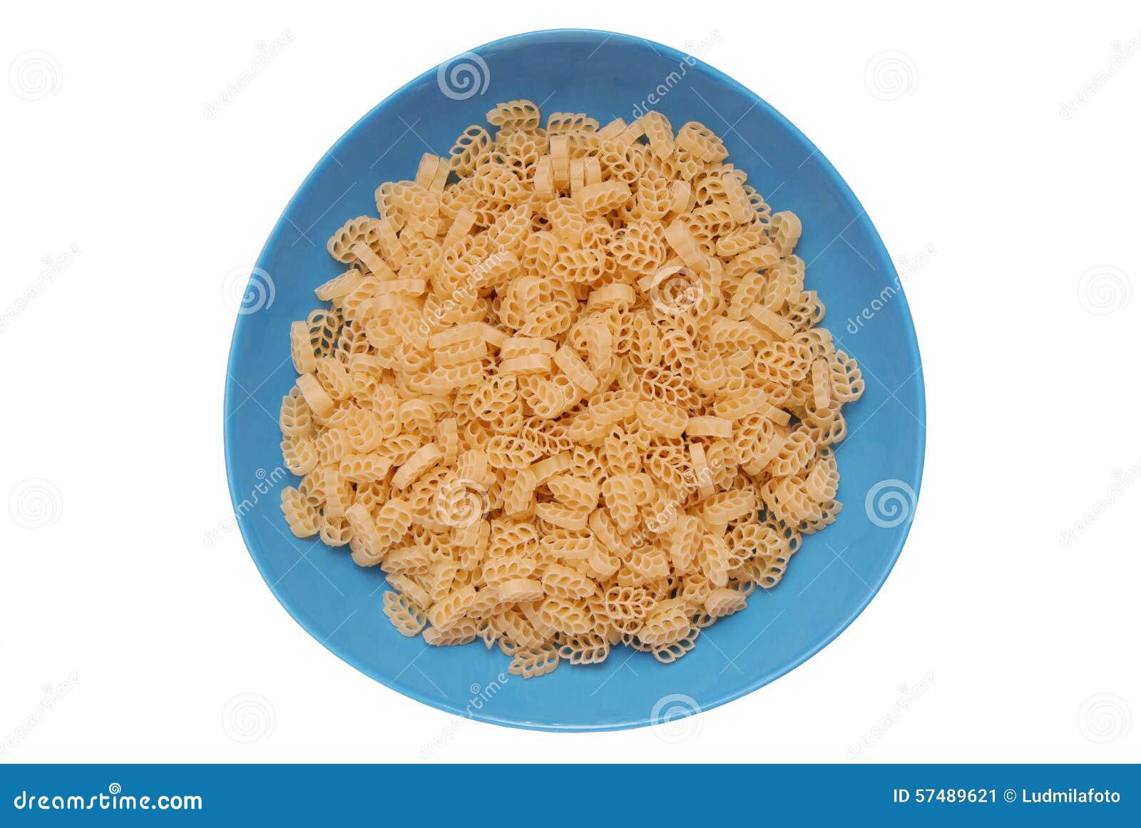 Raw macaroni in blue plate stock image. Image of close - 57489621