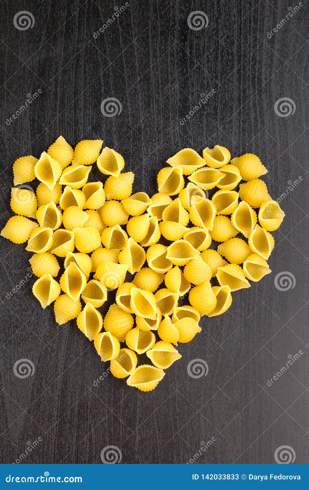 Raw Macaroni - Conchiglie Paste Shells in the Shape of a Heart on a ...