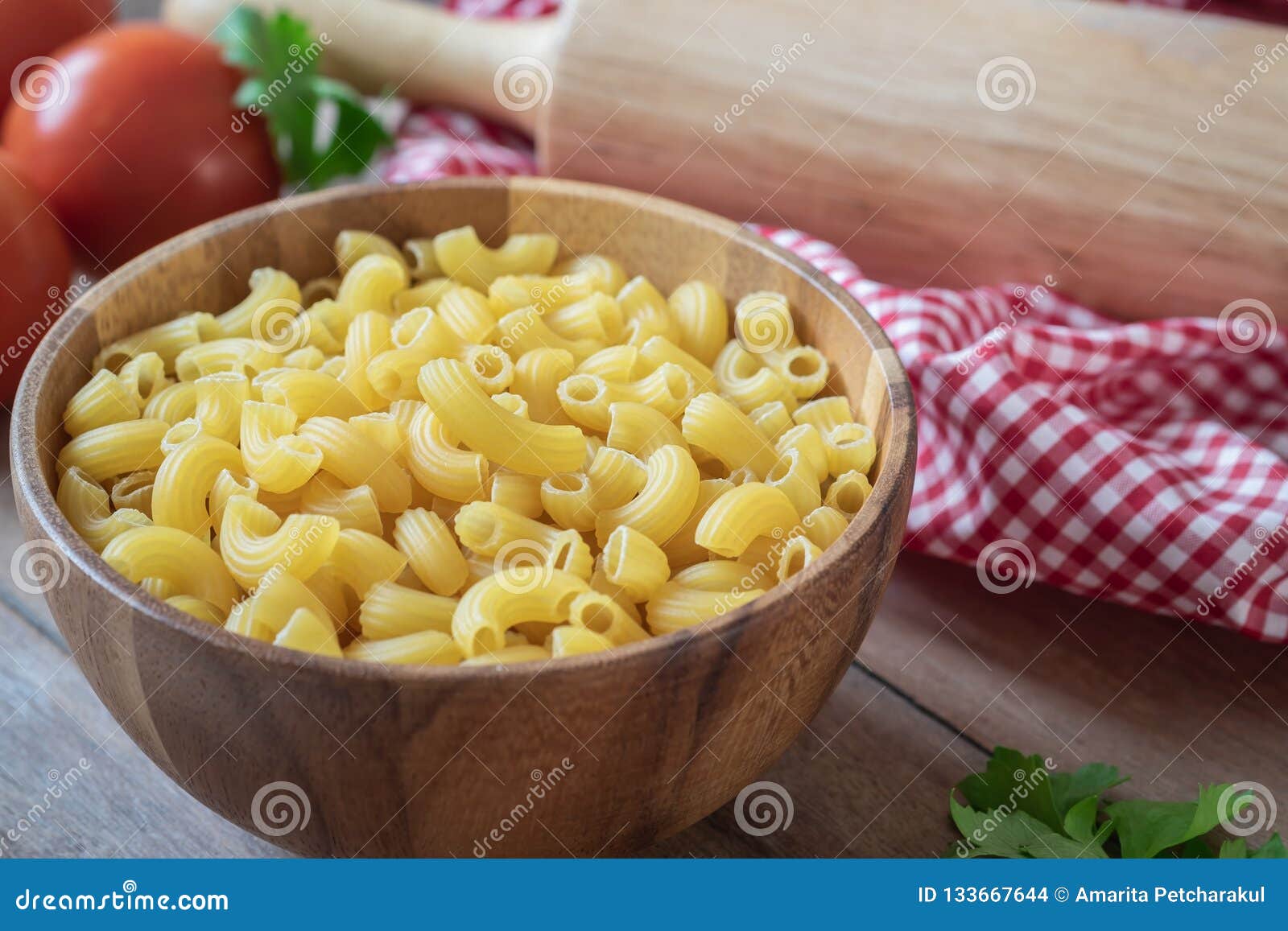 Raw Macaroni Pasta in Wooden Bowl Stock Photo - Image of pile, dinner ...