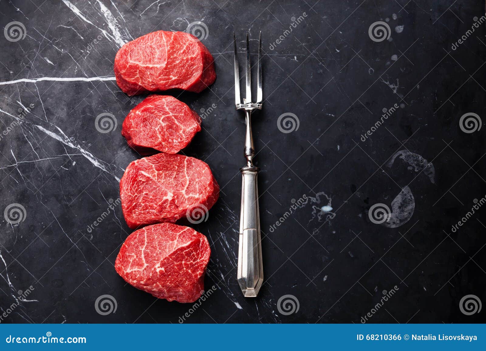 Raw Marbled Meat Steak Filet Mignon and Meat Fork Stock Photo - Image ...