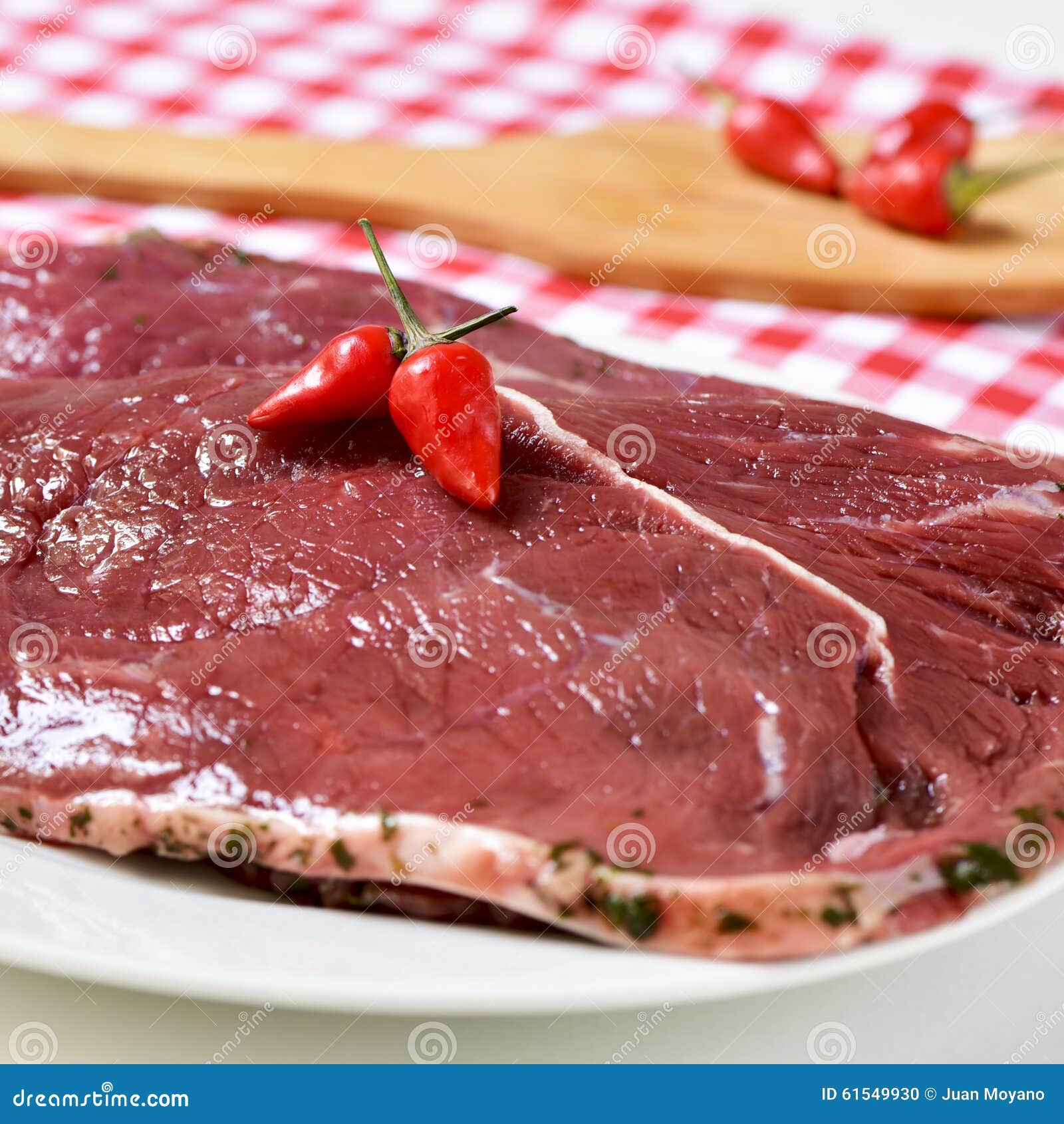 Raw marinated beef fillets stock photo. Image of beef - 61549930