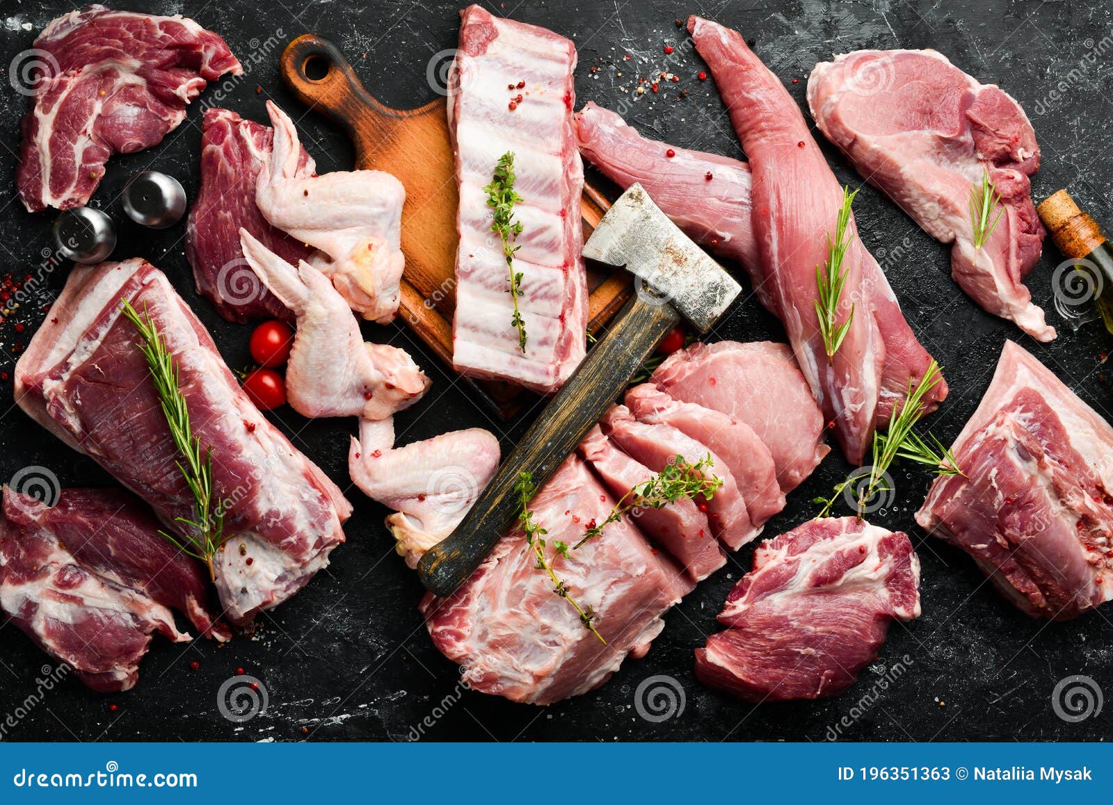 Raw Meat Background. Meat on a Black Stone Background with Spices and ...