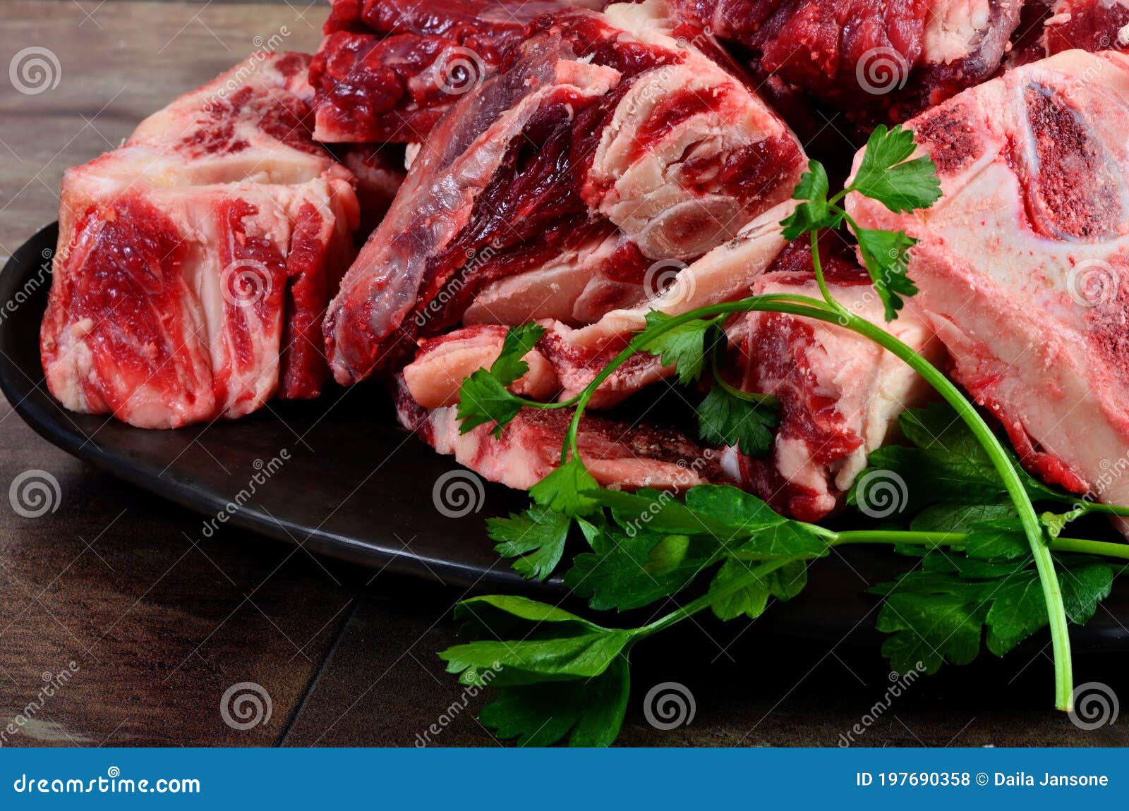 Raw Meat with Bone on Clay Plate and Brown Stone Background.Raw Meat ...
