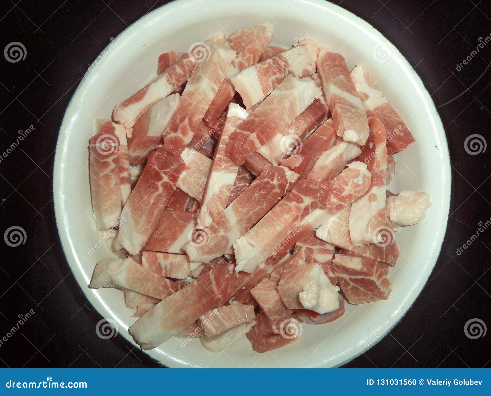 Raw meat cut into pieces stock photo. Image of dinner - 131031560