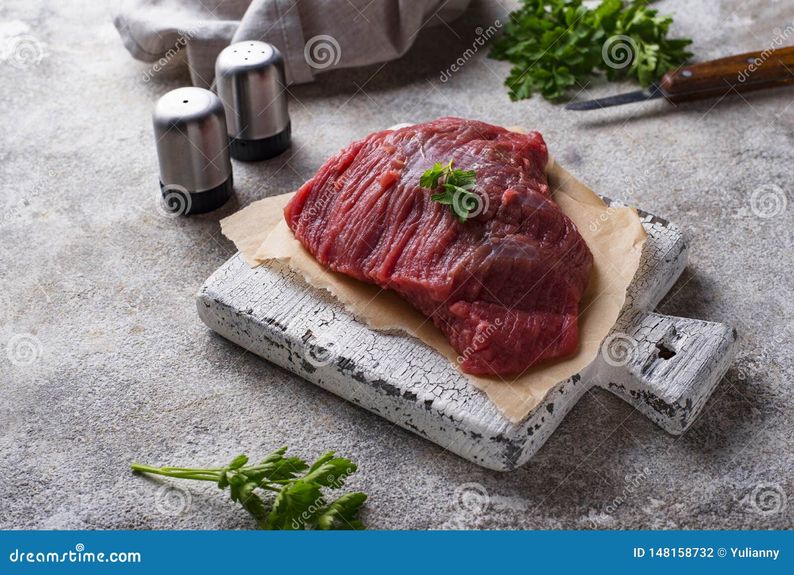 Raw meat on cutting board stock photo. Image of ingredient - 148158732